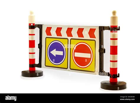 Colorful Traffic Barrier With Directional Signs Indicating Left Turn