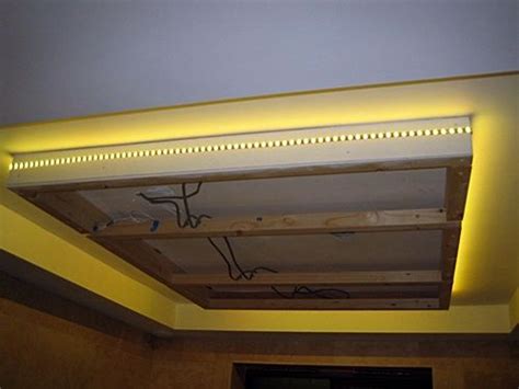 The Lights Are On Above The Door And Below The Ceiling In The Room That Is Under Construction