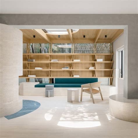 atelier tao c creates serene timber and travertine reading room homestyling guru
