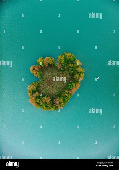 Feeling Lighter Aerial Photo Of A Boat Passing By A Small Island