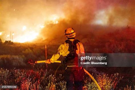 A Firefighter Monitors The Post Fire Near Gorman California Us On