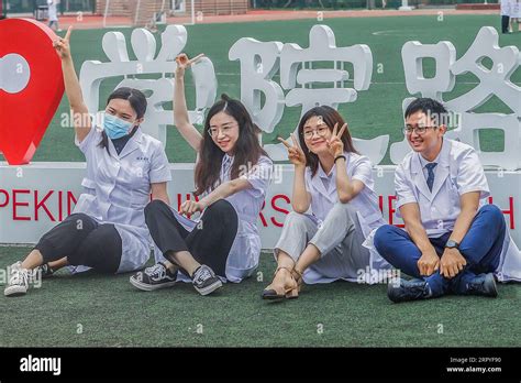 Beijing June Graduates Pose For Photos After The
