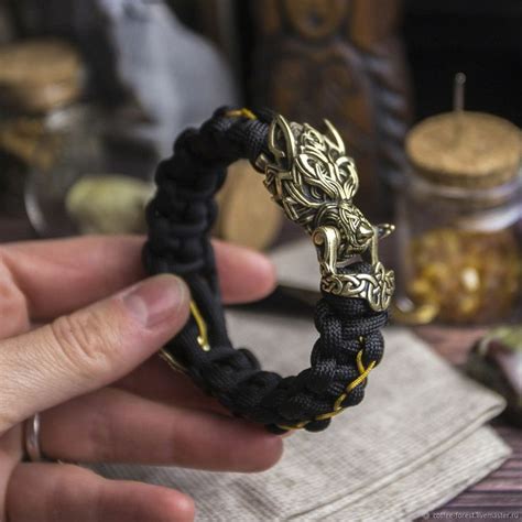 Браслет из паракорда Волк и Агисхьяльм Латунь в интернет магазине на Ярмарке Мастеров