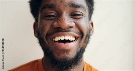 African American Man Laughing And Making Funny Faces At Home Stock