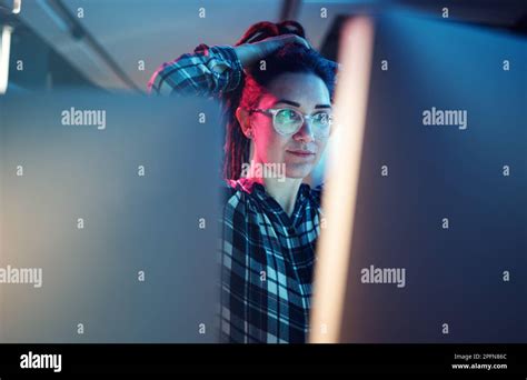 Cybersecurity Malware And Woman Hacker Working On A Computer In The Basement At Night For