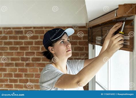 Woman Installing Electrical Switches Checking Fastening Screws Stock