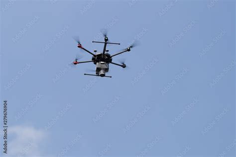 Drone Equipped With A Distribution Kit Precisely Releases Capsules Of