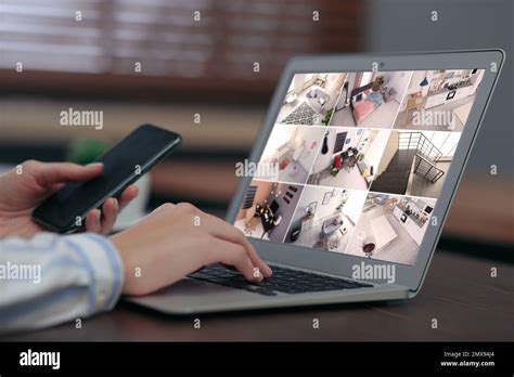 Woman Monitoring Modern Cctv Cameras On Laptop Indoors Closeup Home Security System Stock