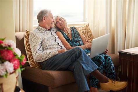 Senior Couple And Love With Laptop In House For Watching Movie