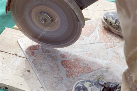 Man Cutting Floor Tiles Stock Image F044 0725 Science Photo Library