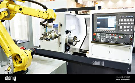 Robotic Arm And Cnc Lathe Machine Stock Photo Alamy