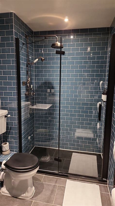 Blue Tiled Bathroom With Stand Up Shower