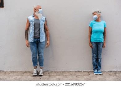 2 Thousand Two People Standing Next Each Other Royalty Free Images
