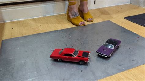 Giantess Atari Queen Destroys A Plymouth Road Runner And Dodge Challenger