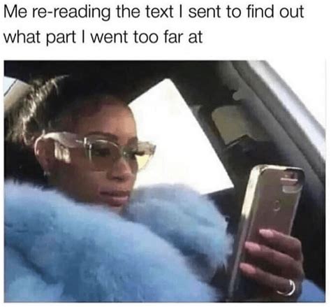 A Woman Sitting In The Back Seat Of A Car Holding A Cell Phone