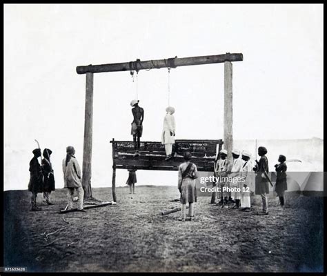 Two Rebels Hanging From A Gallows Where They Were Executed Following