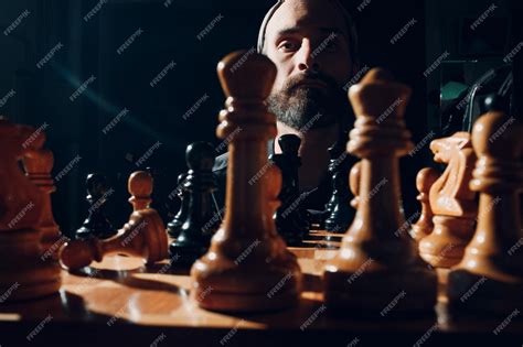 Premium Photo Young Adult Handsome Man Playing Chess In Dark With