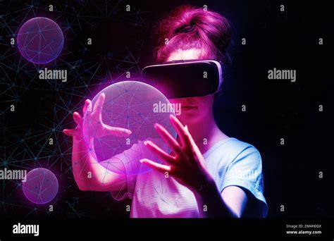 Portrait Of Young Woman In Vr Glasses Creates 3d Simulation Of Pink