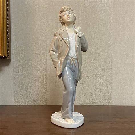 Фарфоровая статуэтка Nao By Lladro «юнга — цена 2800 грн в каталоге Статуэтки Купить товары