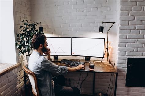 Premium Photo Adult Bearded Man Working Sitting At Home Desk At Computer Selfisolation During