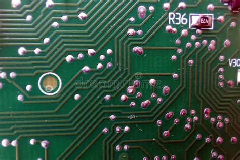 Intricate Details Of An Electronic Circuit Board Showcasing Vibrant Solder Connections Stock