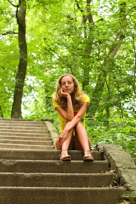 Young Girl Sitting On The Stairs Stock Image Image Of Trees