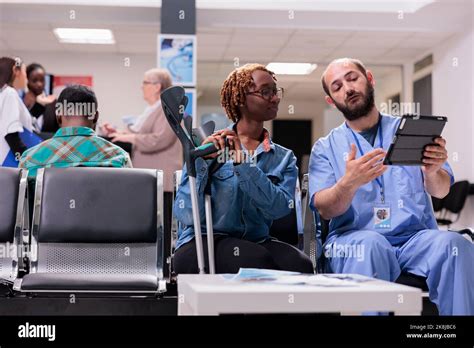 General Practitioner Interpreting Clinical Analysis Of Female Young African American Patient At