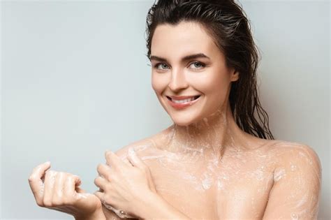Premium Photo Sensual Woman Washing Her Body With Shower Gel