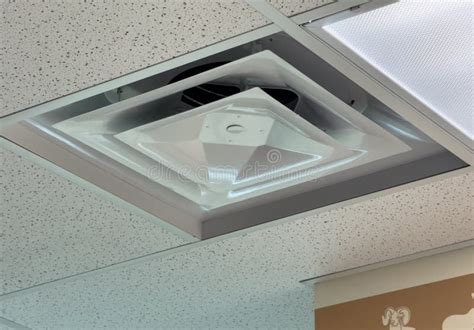 A Ceiling Mounted Square Air Diffuser With Concentric Stepped Pyramids Is Shown Editorial Photo