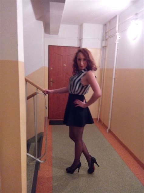 Redhead In Mini Skirt At The Staircase Pic