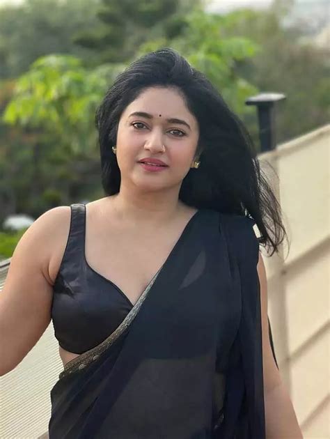 Poonam Bajwa Glows In Classic Black Saree Embodying Elegance And