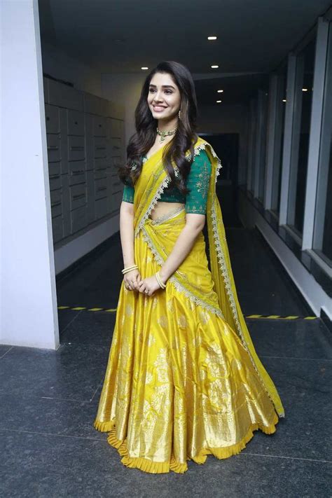 Krithi Shetty Stuns In A Yellow Half Saree At Uppena Pre Release Event