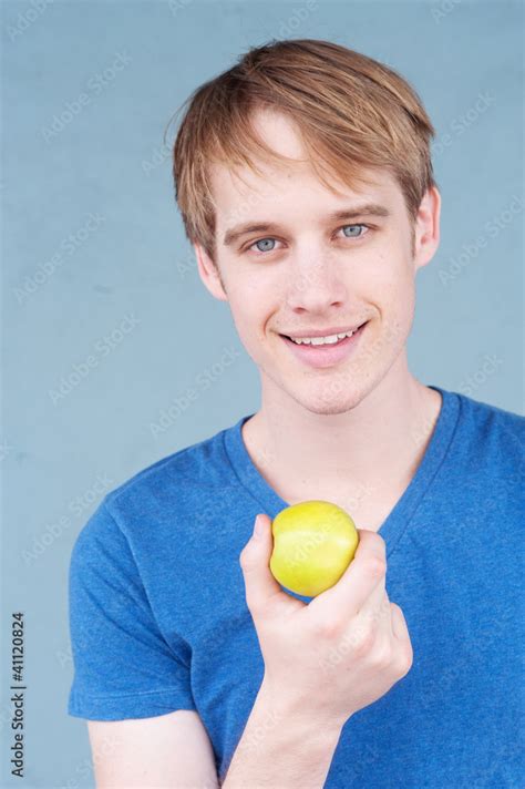 Portrait Of A Babe Man With An Apple Stock Photo Adobe Stock