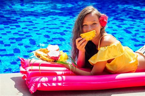 Premium Photo Beautiful Girl Lying On An Inflatable Pink Mattress
