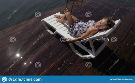 Woman Lie On A Sunbed In Sunglasses And A Boho Silk Shawl Girl Rest On