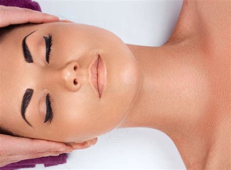 Face Massage Close Up Of Young Woman Getting Spa Massage Treatment At