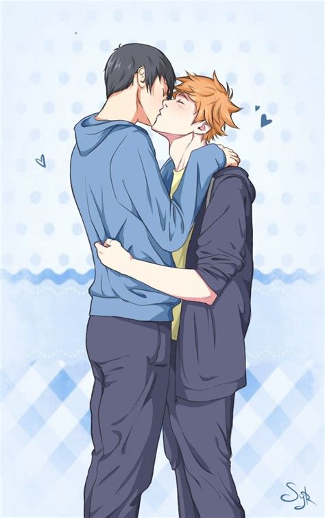 Two People Are Hugging Each Other In Front Of A Blue Background