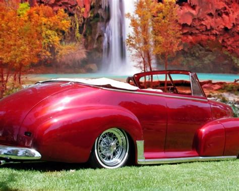 Red Chevy Convertible Parked In Front Of Waterfall Red Convertible