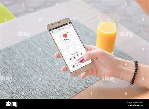 Concept Of Measuring Heart Rate App Girl Uses A Sensor On Mobile Phone