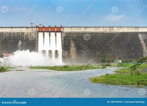 Amazing And Beautiful Water Release At Spillway Or Overflows At Big Dam With Blue Sky And Cloud