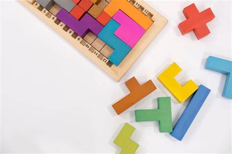 Premium Photo The Concept Of Logical Thinking Geometric Shapes On A Wooden Background Tetris