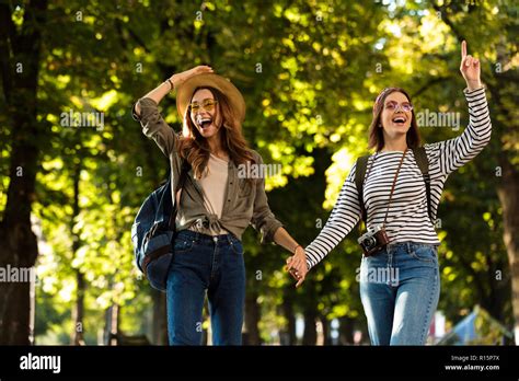 Image Of Excited Pretty Young Happy Women Friends Walking Outdoors With
