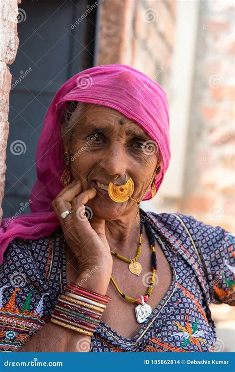 A Beautiful And A Happy Woman In Traditional Attire In A Village