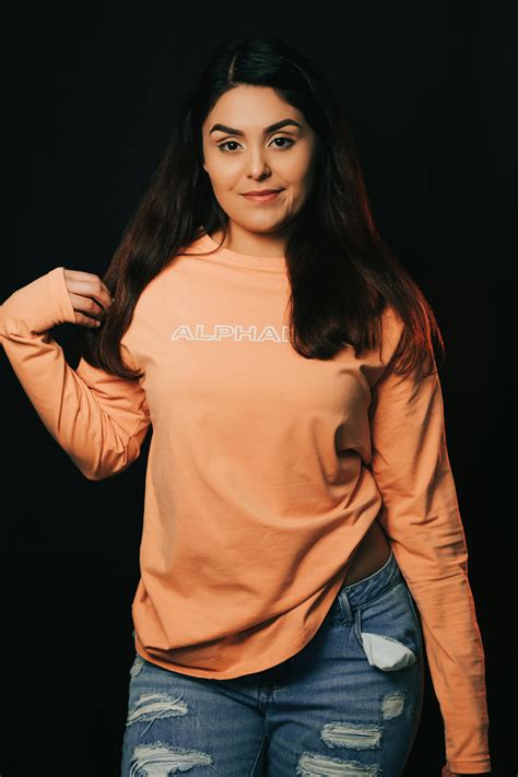 Woman With Straight Hair Women In Orange Sweatshirt Posing In Studio