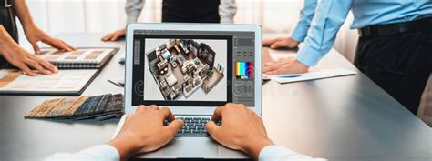 Group Of Interior Architect At Table Choosing Material Selection