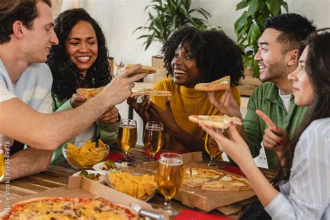 Happy Multiracial Friends Eating Pizza Together At Home Happy Friends