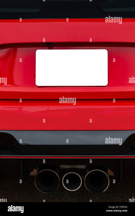 Vertical Shot Of A Blank White License Plate On The Back Of A Red Car