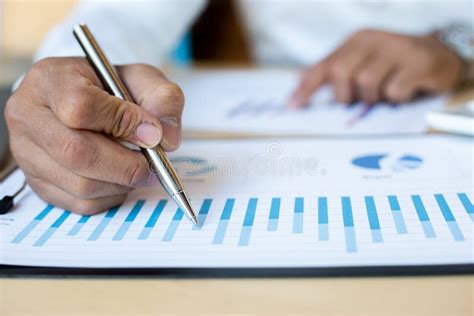 A Financial Businessman A Young Man Analyzes Financial Data Using A