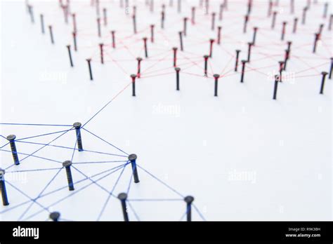 Connecting Networks Concept Two Network Connected With Yarn Red And Blue On White Paper