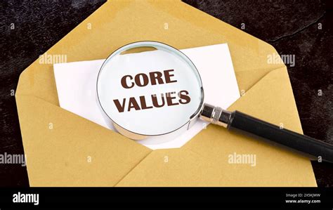 Core Values Ethics Concept Text On A White Sheet Of Paper Through A Magnifying Glass On The